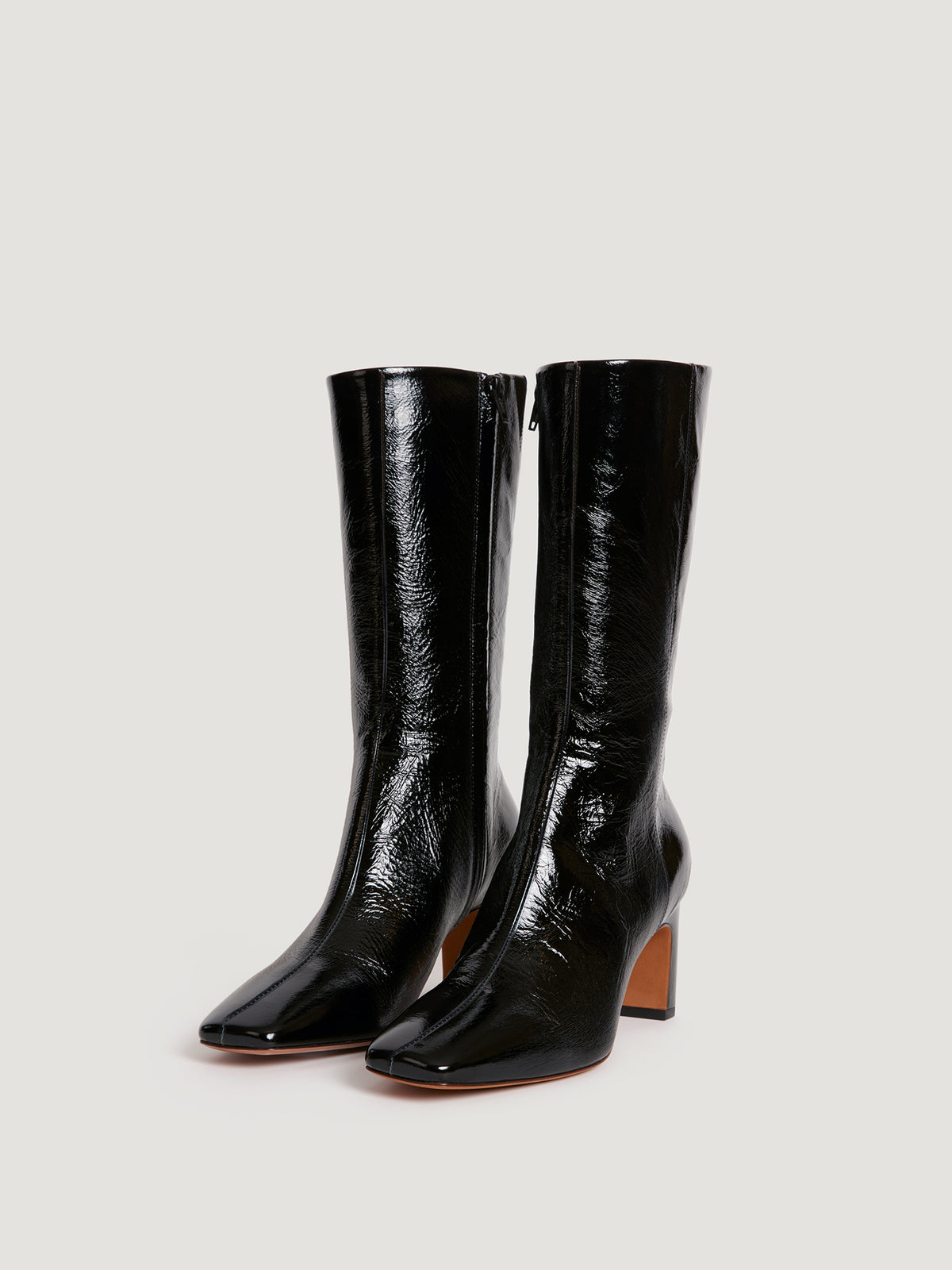 Heeled ankle boots in black patent leather | Rouje